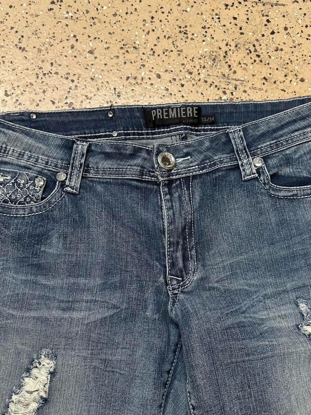 Premier | Jeans | Ripped Blue Low Rise Jeans With A Flared Leg | Poshmark